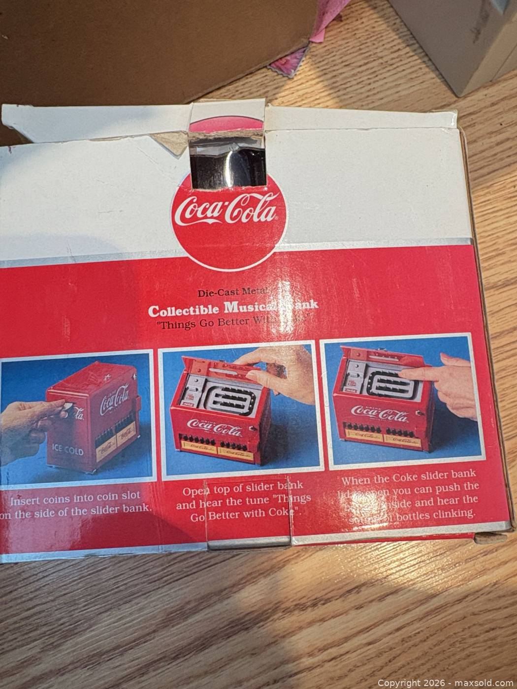 Coca-Cola die-cast musical coin bank | Maxsold