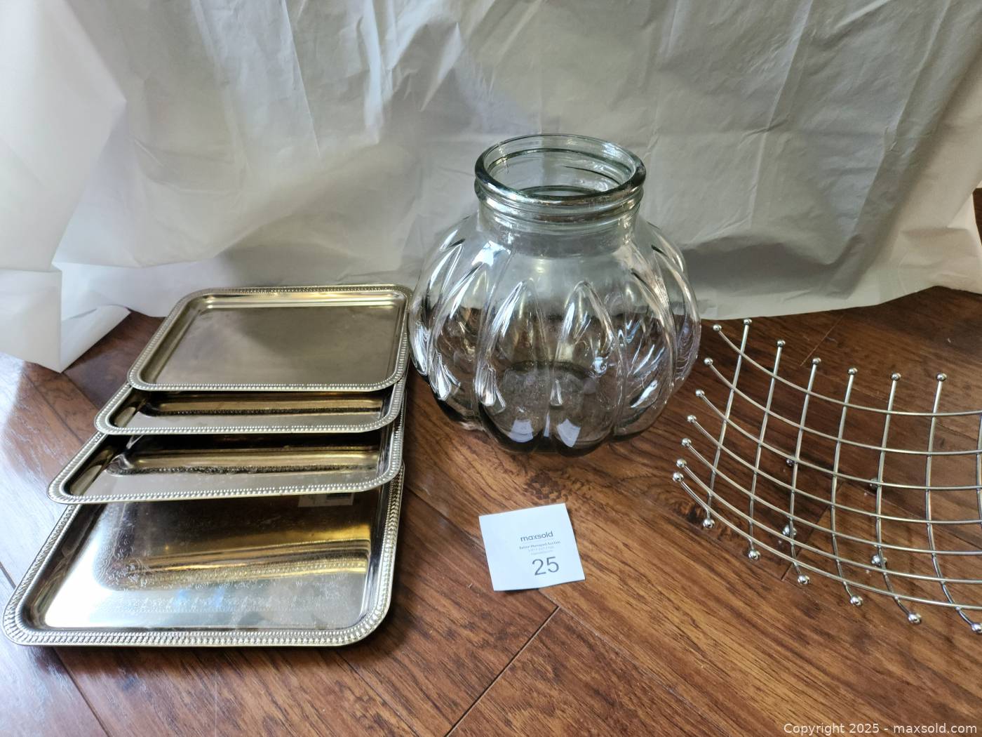 Large glass jar, 4 metal trays, wire grid basket | Maxsold