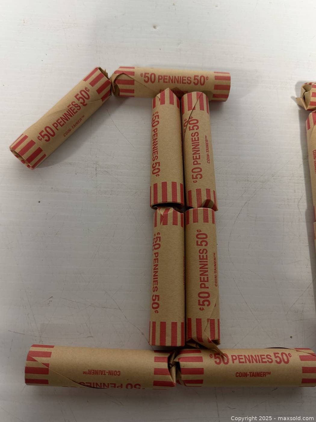 $10 face value rolled pennies | Maxsold