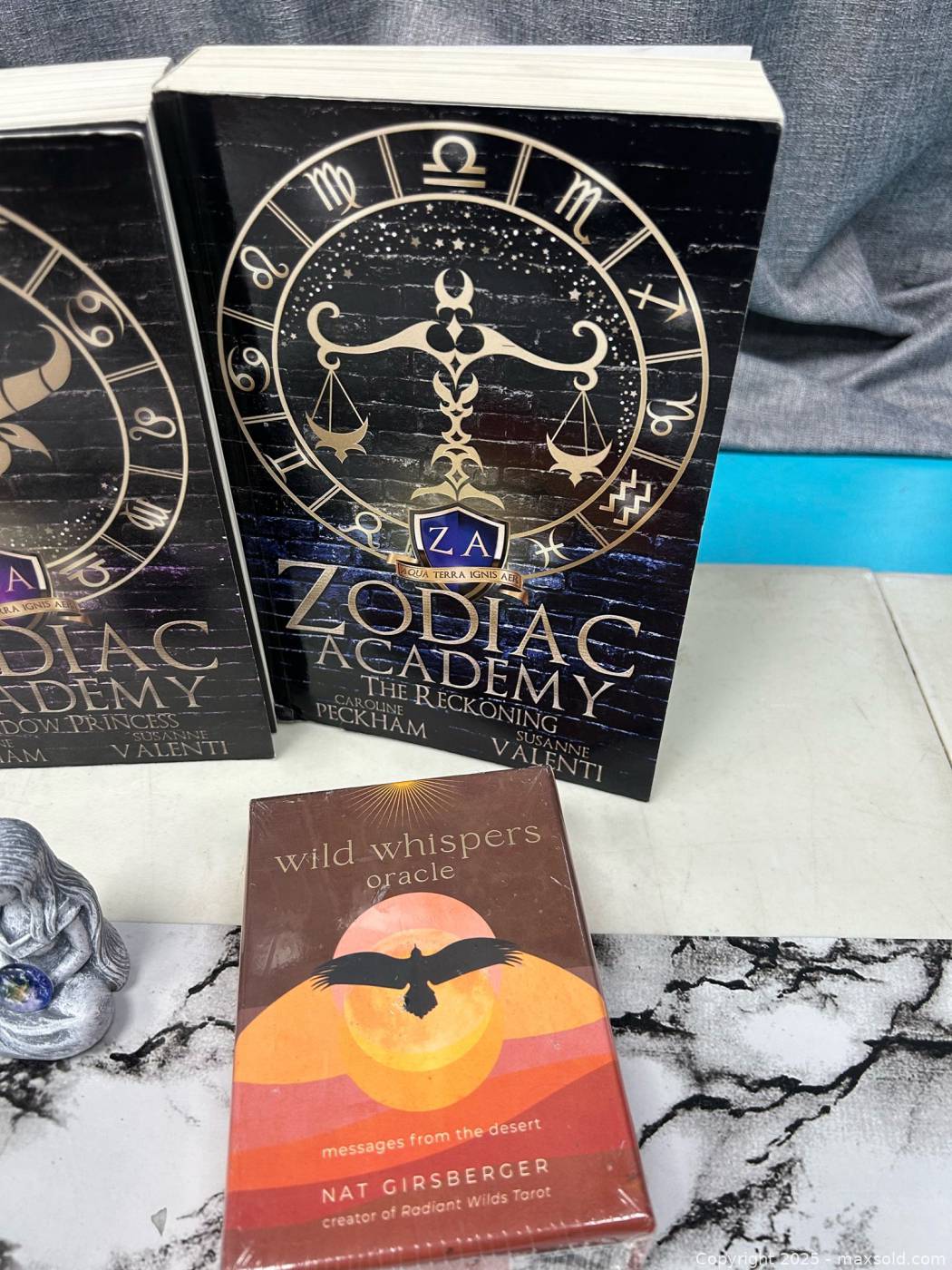 Zodiac Academy paperbacks, Wild Whispers Oracle deck, figurine | Maxsold