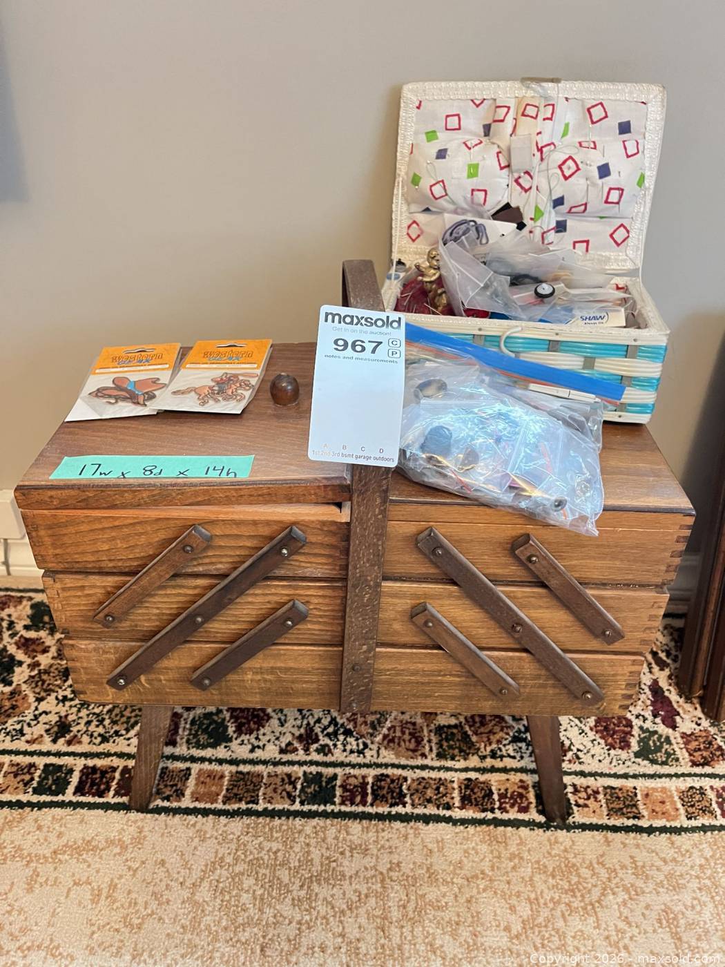 Wood cantilever sewing box with notions | Maxsold