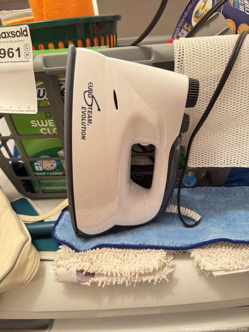 Household cleaning items, iron, Moen cover plate | Maxsold