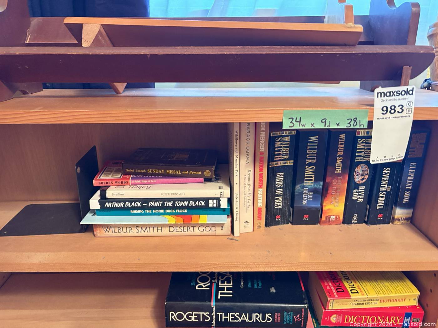Solid wood light oak bookcase with books | Maxsold