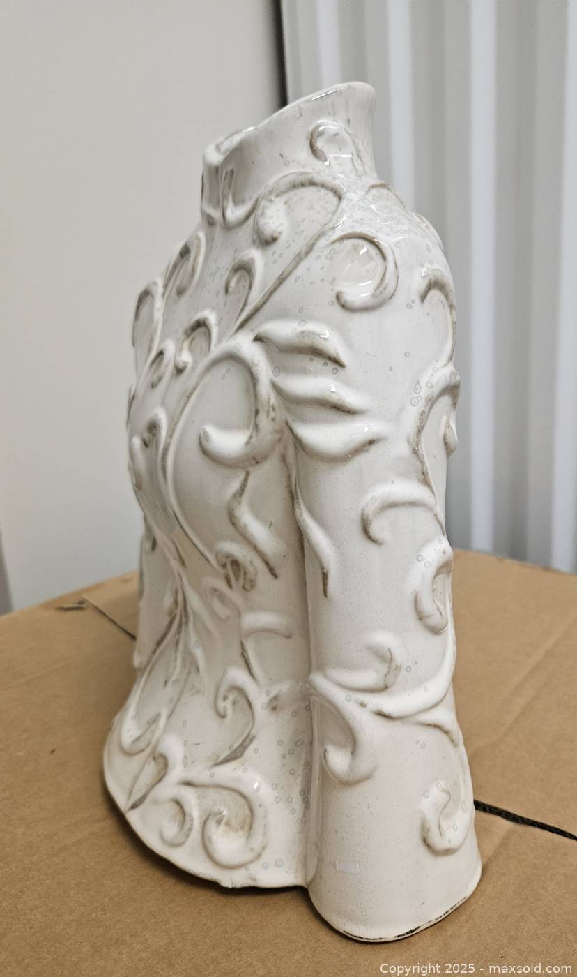 Off-white glazed ceramic torso jacket vase | Maxsold