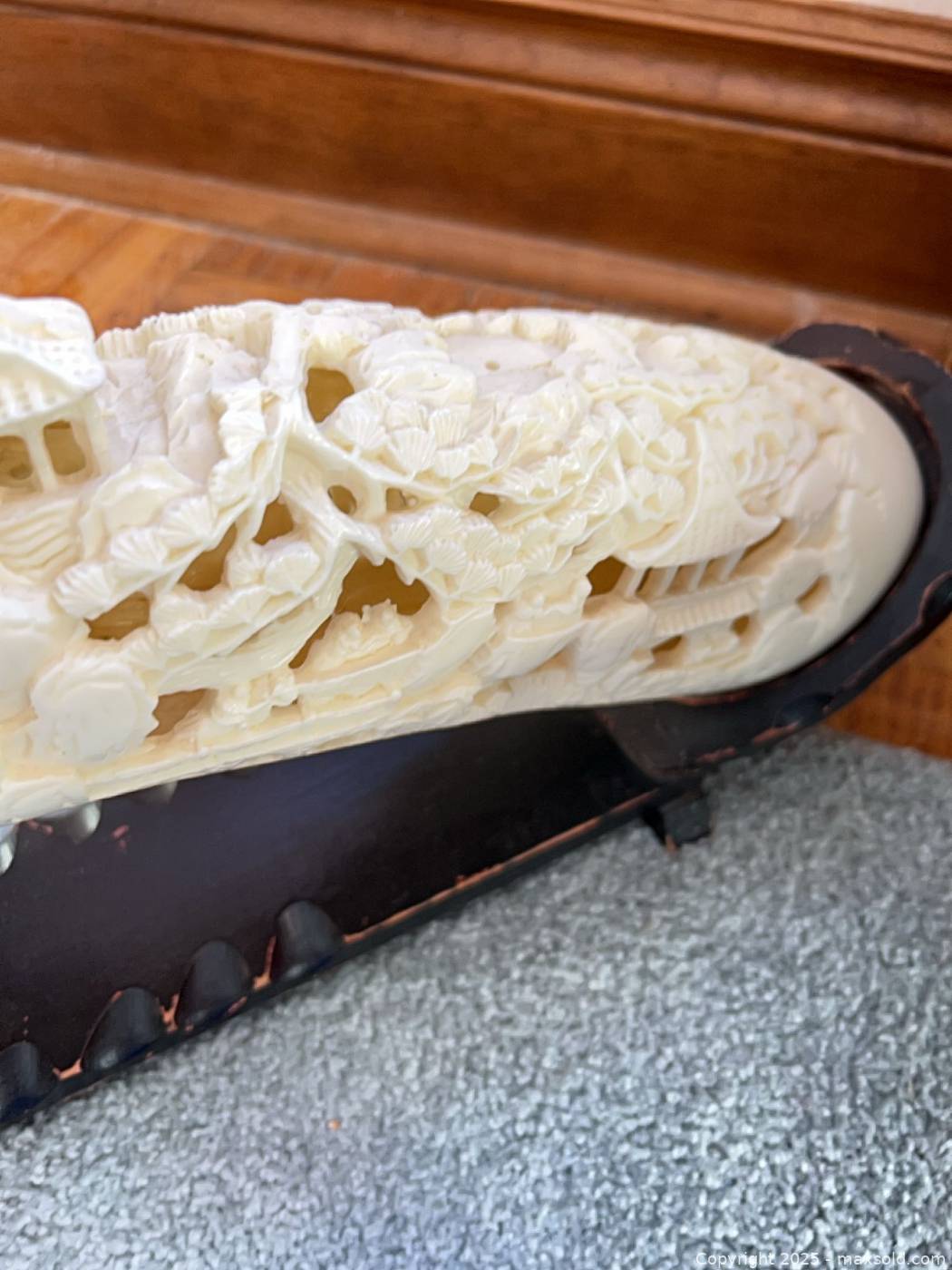 Resin carved boat figurine on wood stand | Maxsold