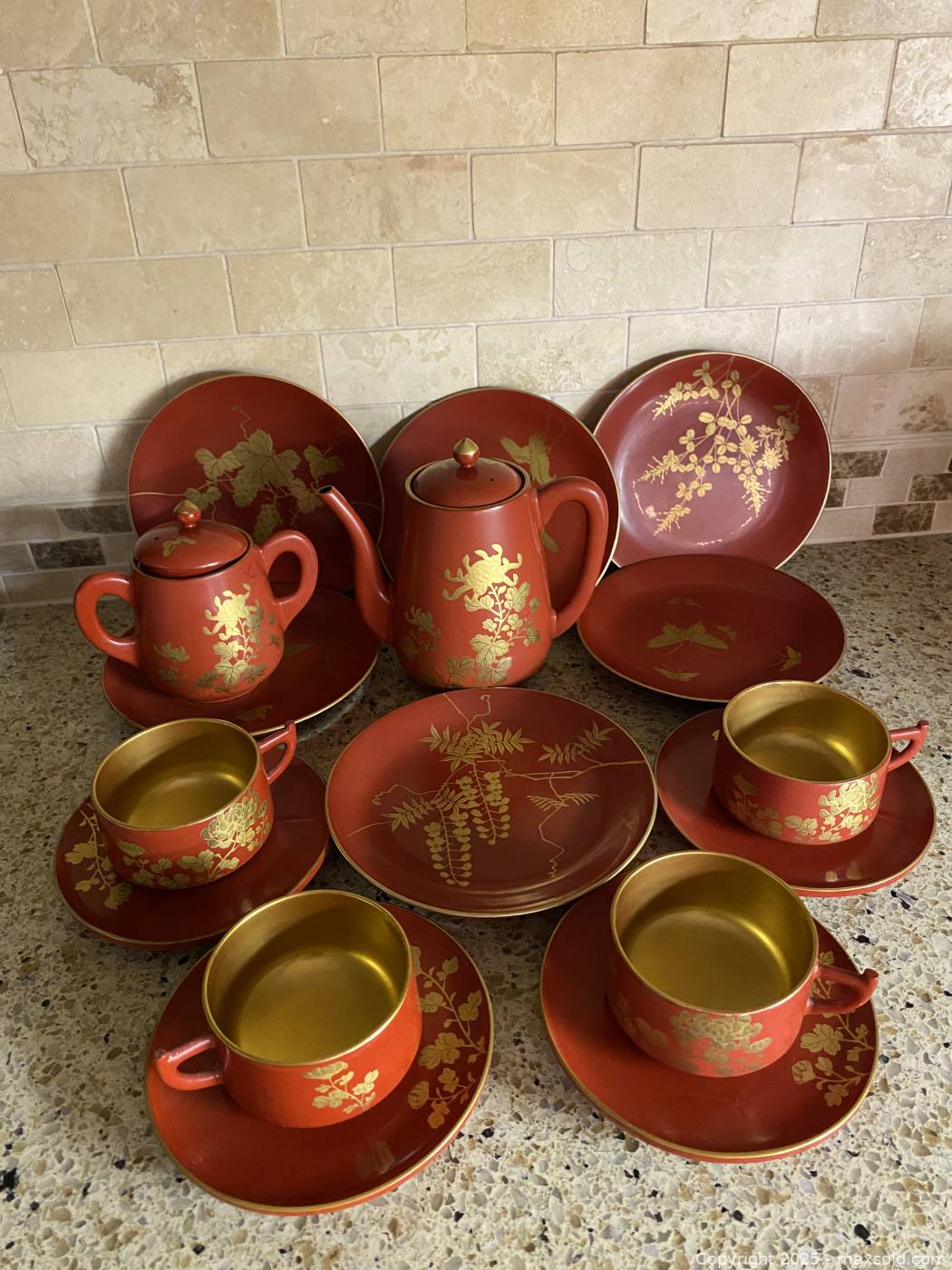 Red lacquer gilt floral lacquerware tea service | Maxsold