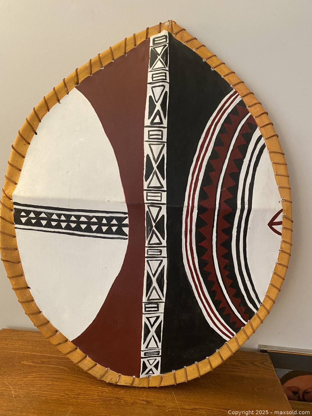 Decorative tribal-style canvas shield wall art 31x37 in | Maxsold
