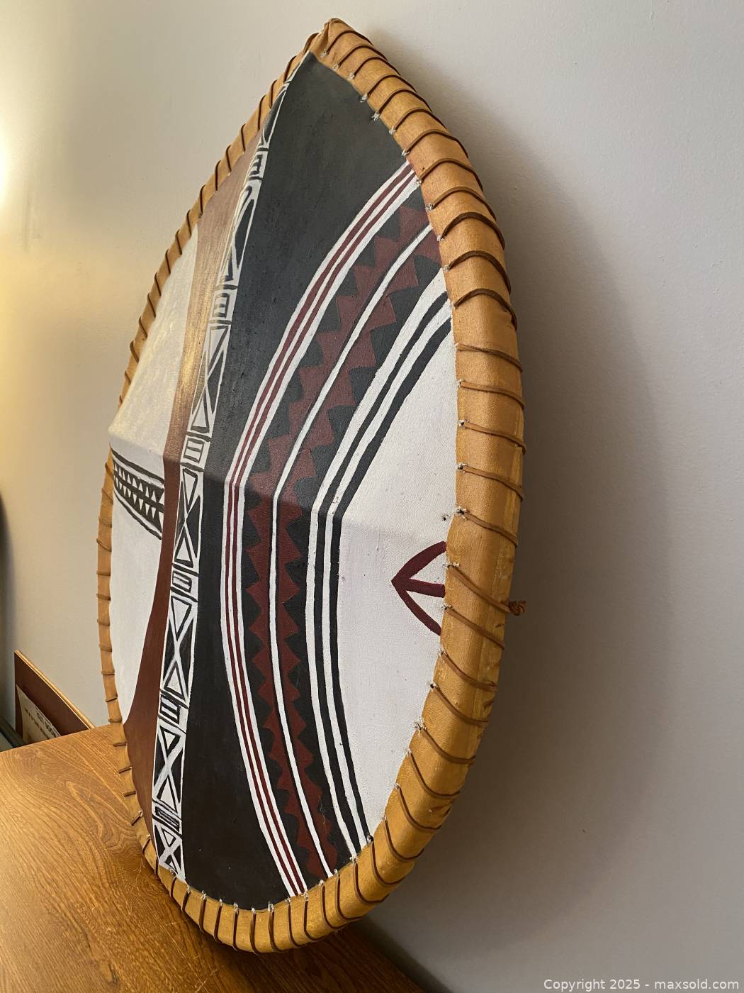 Decorative tribal-style canvas shield wall art 31x37 in | Maxsold