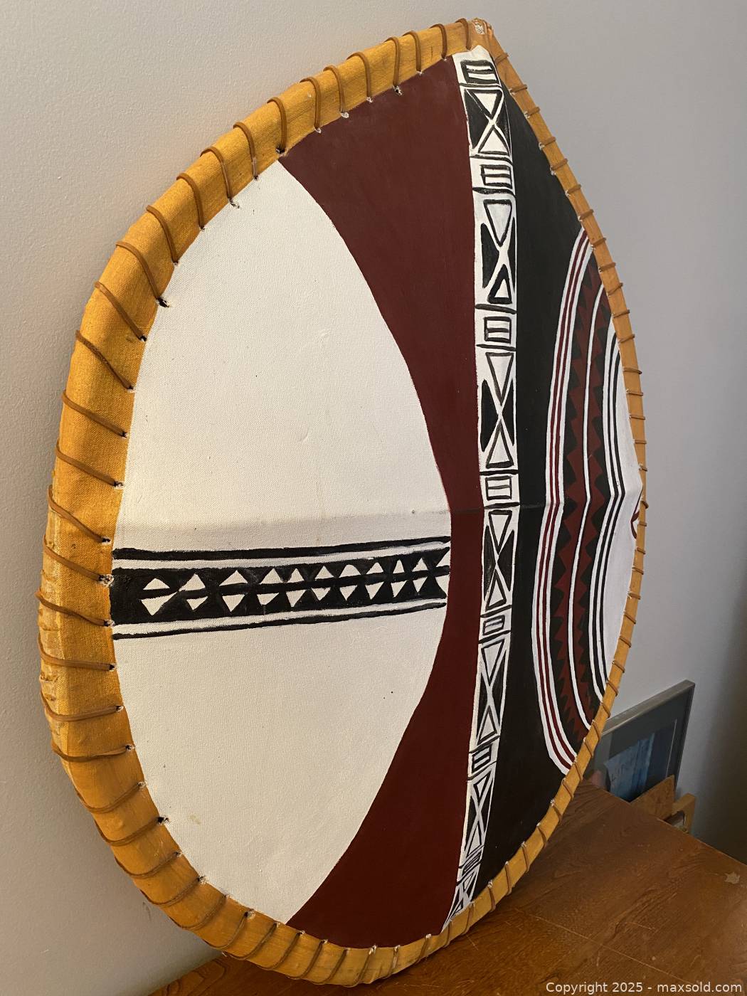 Decorative tribal-style canvas shield wall art 31x37 in | Maxsold