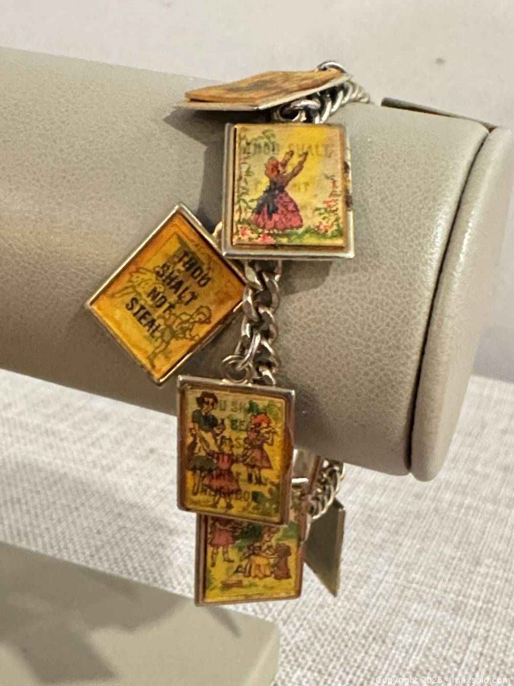 1950s Ten Commandments charm bracelet and prayer book pendant | Maxsold