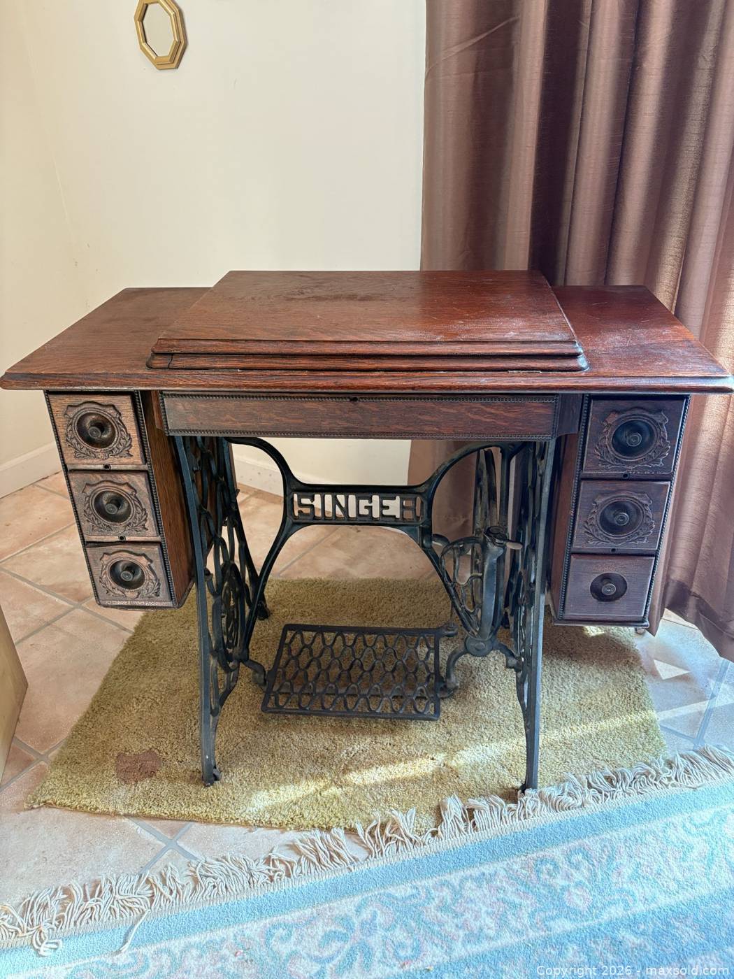 Singer treadle sewing machine with oak cabinet | Maxsold