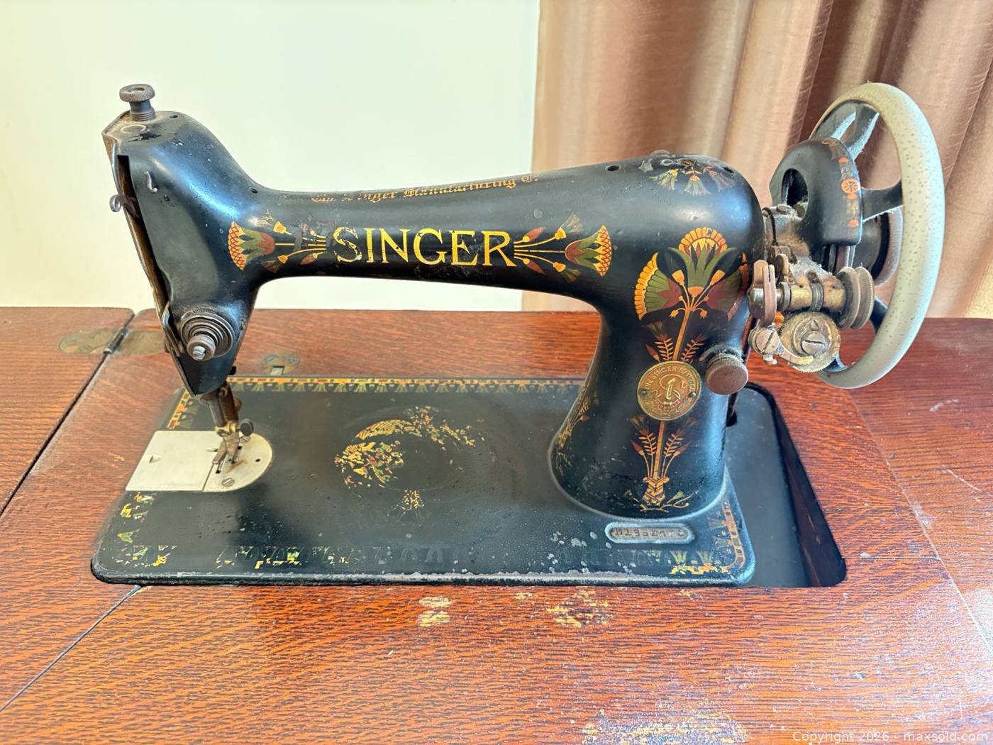 Singer treadle sewing machine with oak cabinet | Maxsold