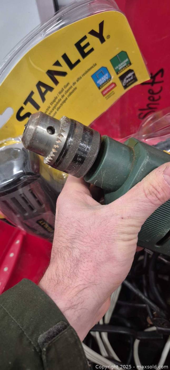 Corded drill, Stanley electric staple gun and assorted hand tools | Maxsold