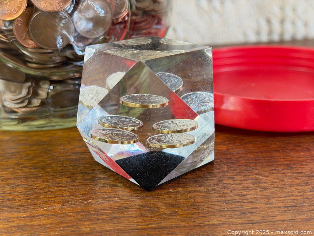 Jar of Canadian and U.S. Pennies and Lucite Coin Paperweight | Maxsold