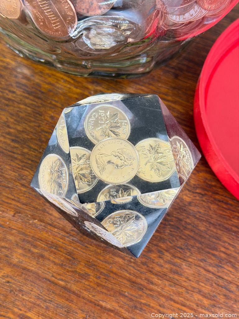 Jar of Canadian and U.S. Pennies and Lucite Coin Paperweight | Maxsold
