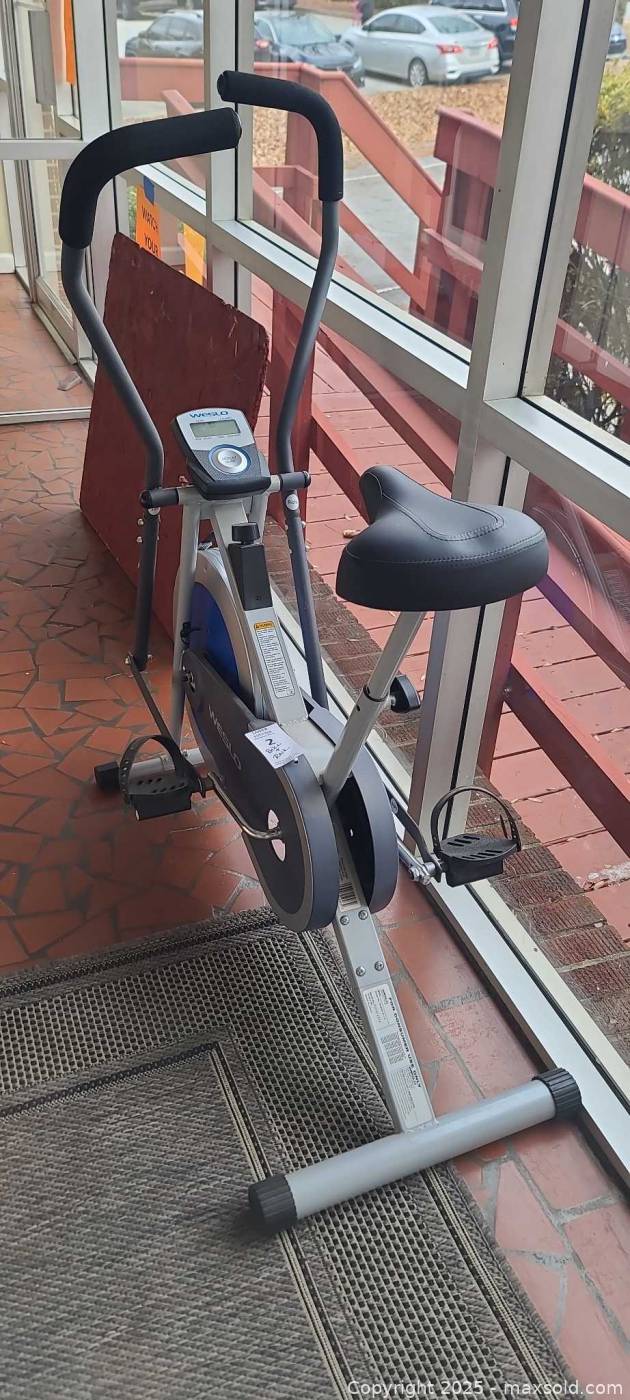Weslo exercise bike, rolling cart and fitness accessories | Maxsold