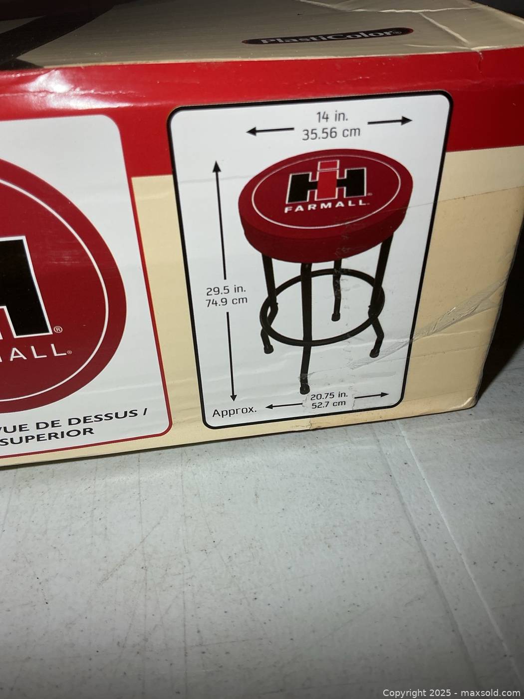 Farmall garage stool in box | Maxsold
