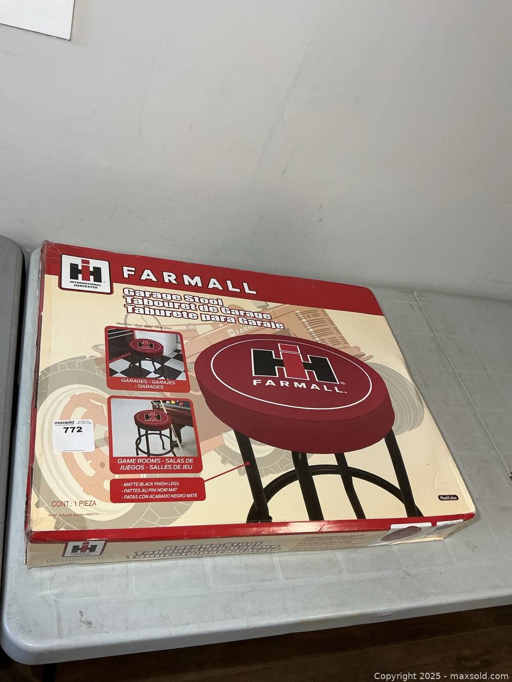 Farmall red garage stool new in box | Maxsold