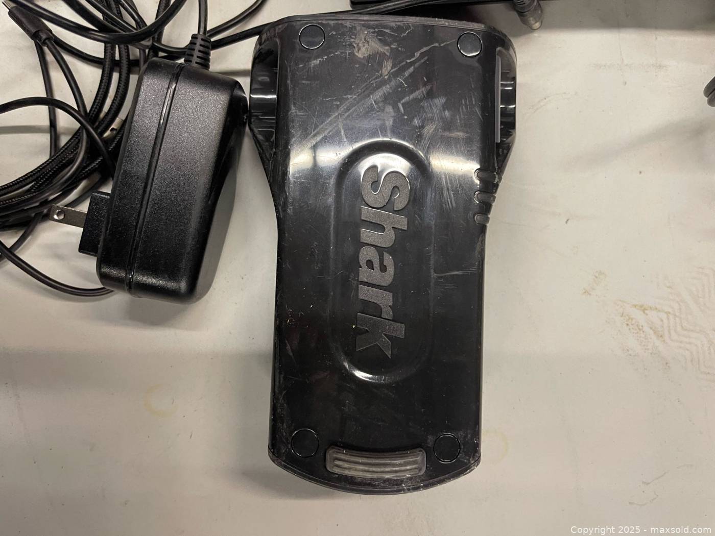 Shark battery pack, 4-slot charger, AC adapters, assorted USB cables ...