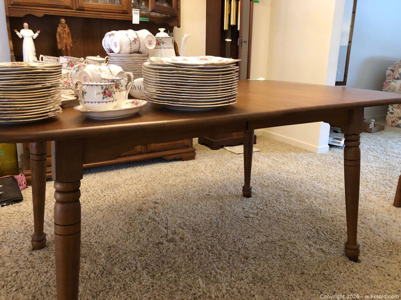 Wood dining table with 2 leaves | Maxsold