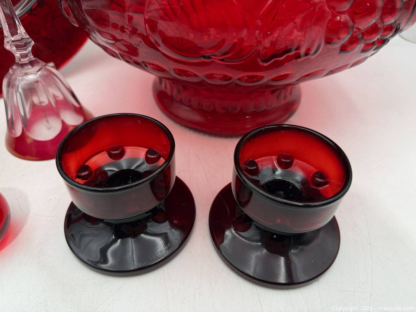 Ruby red glass serving and decor pieces | Maxsold