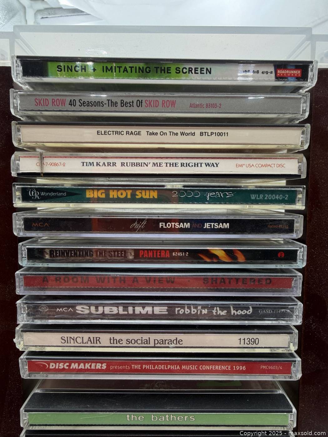 Rock music CDs and CD tower holder | Maxsold