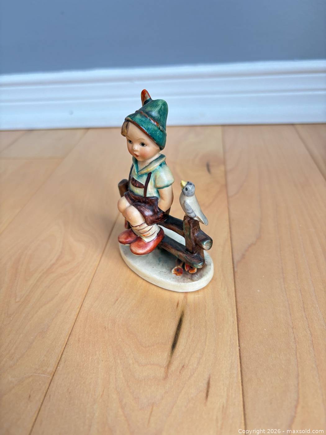 Hand-Painted Porcelain Boy on Fence Figurine | Maxsold