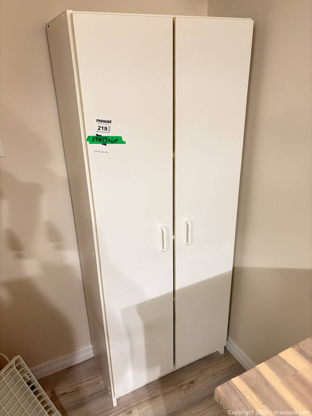 White tall storage cabinet | Maxsold