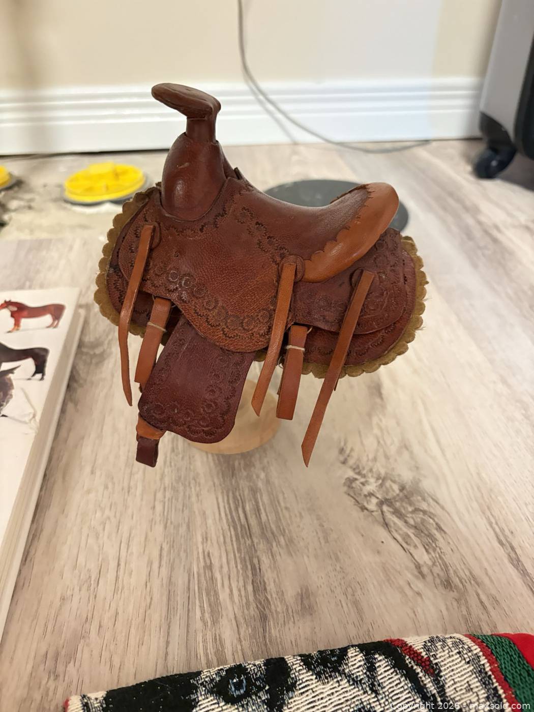 Wooden storage box, books, miniature leather saddle & decor | Maxsold