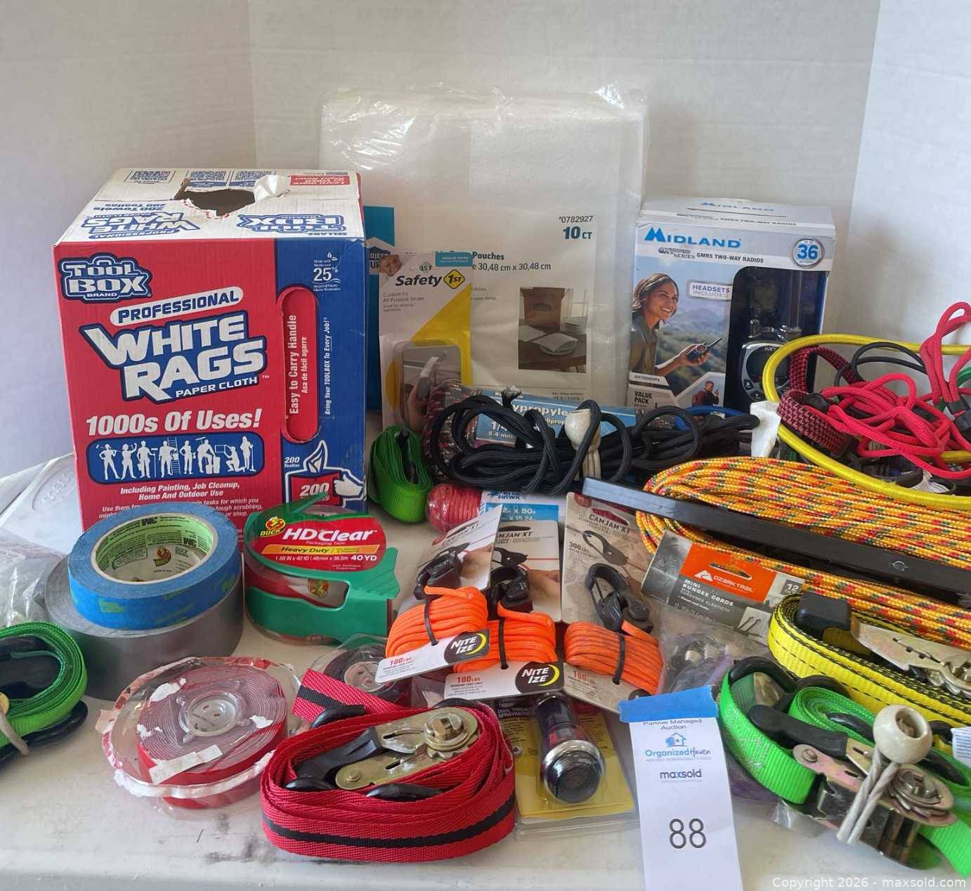 Ratchet straps, bungee cords, tape, radio, rags | Maxsold