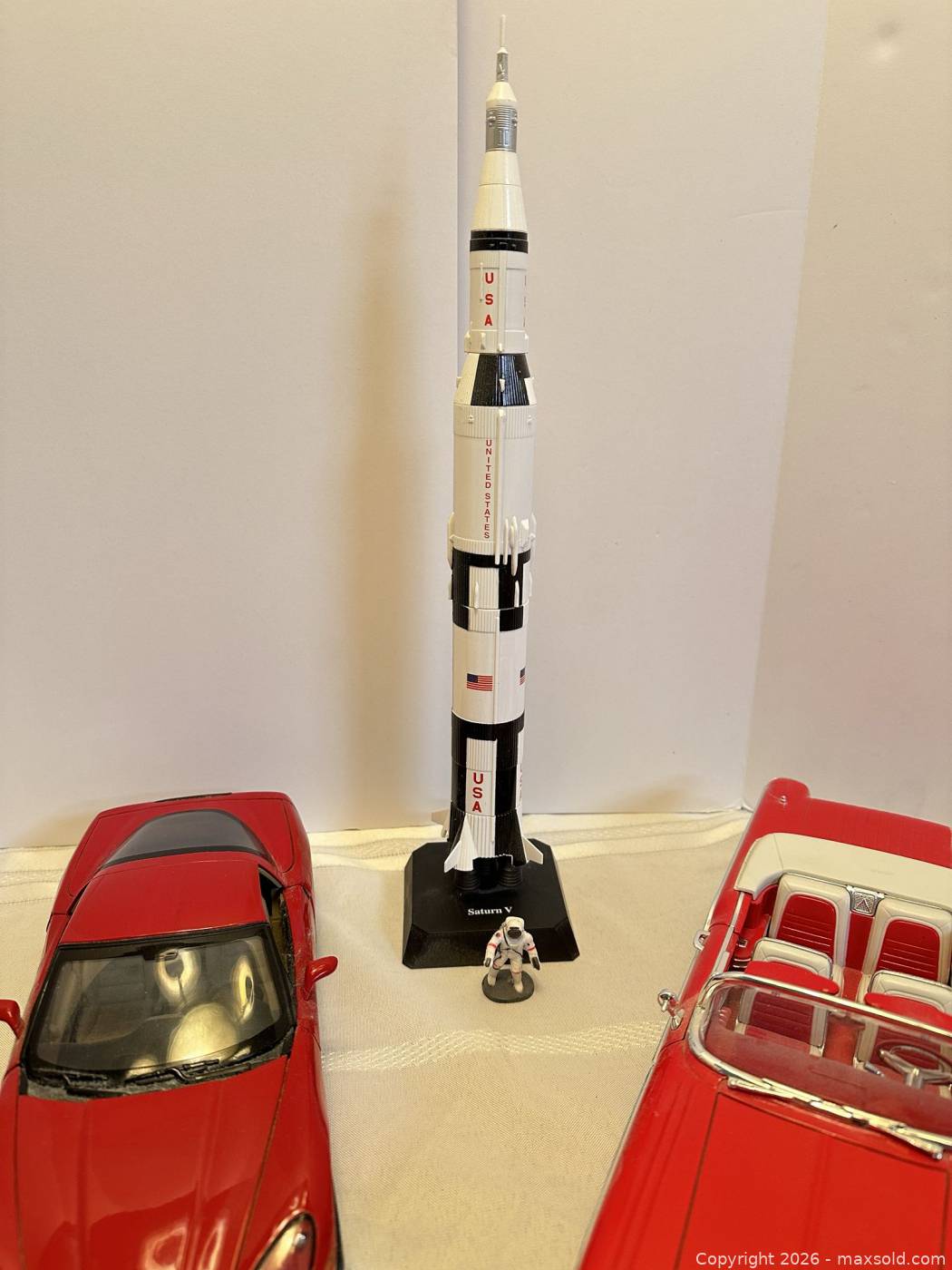 Mixed-scale diecast vehicles and Saturn V model | Maxsold