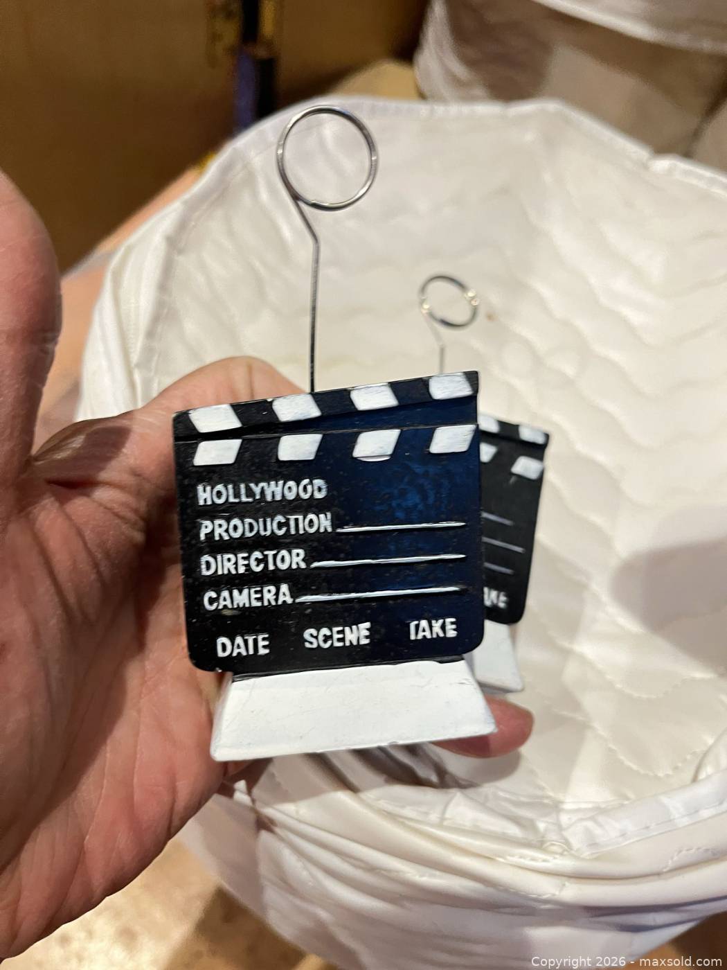 Assorted napkin rings and clapper card holders | Maxsold