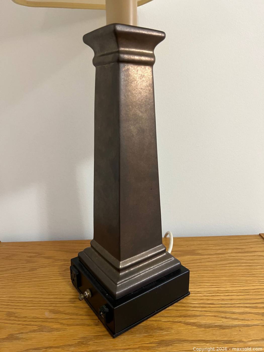 Vintage bronze-like obelisk table lamp, outlet + phone jack | Maxsold
