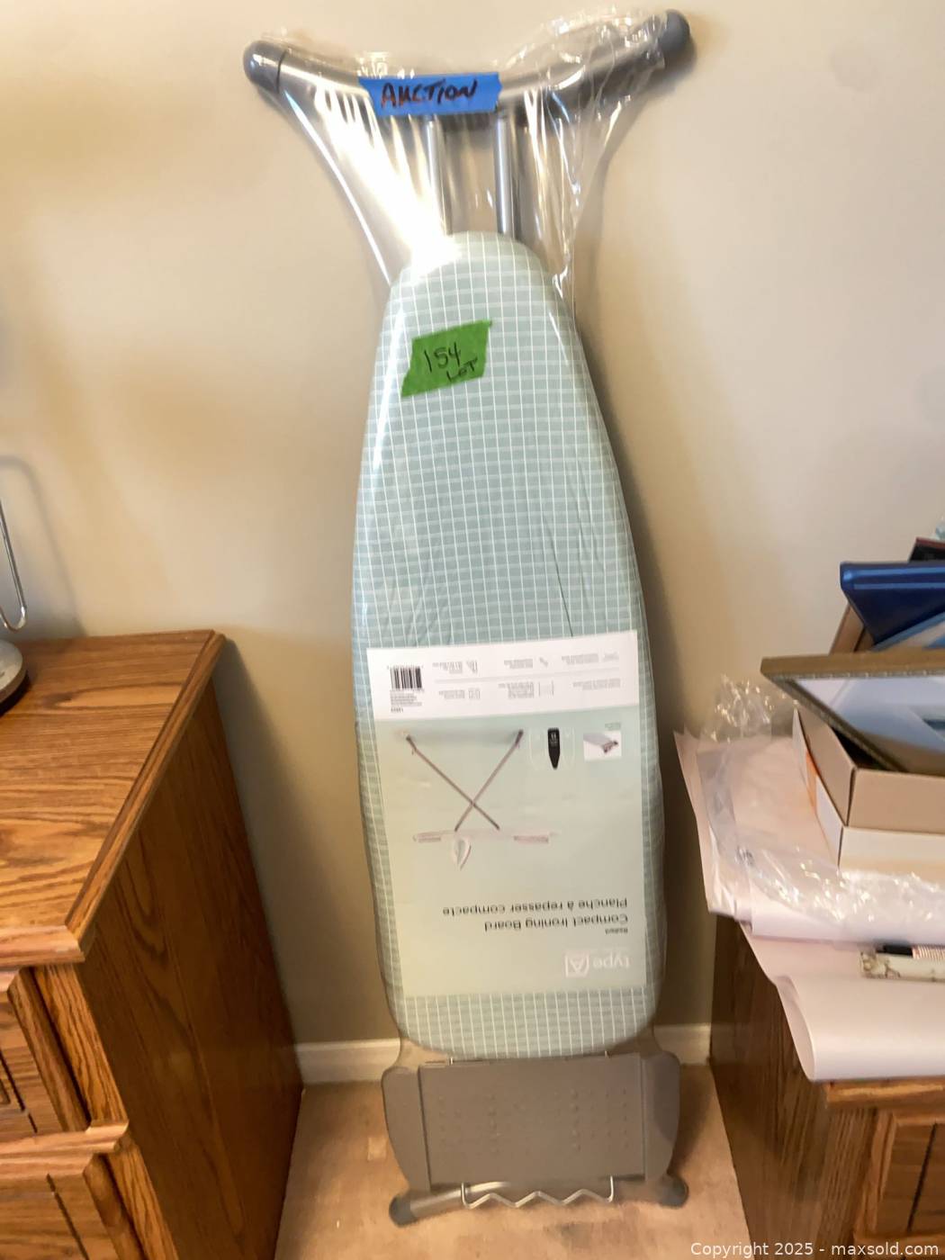 Full-size ironing board with iron rest | Maxsold