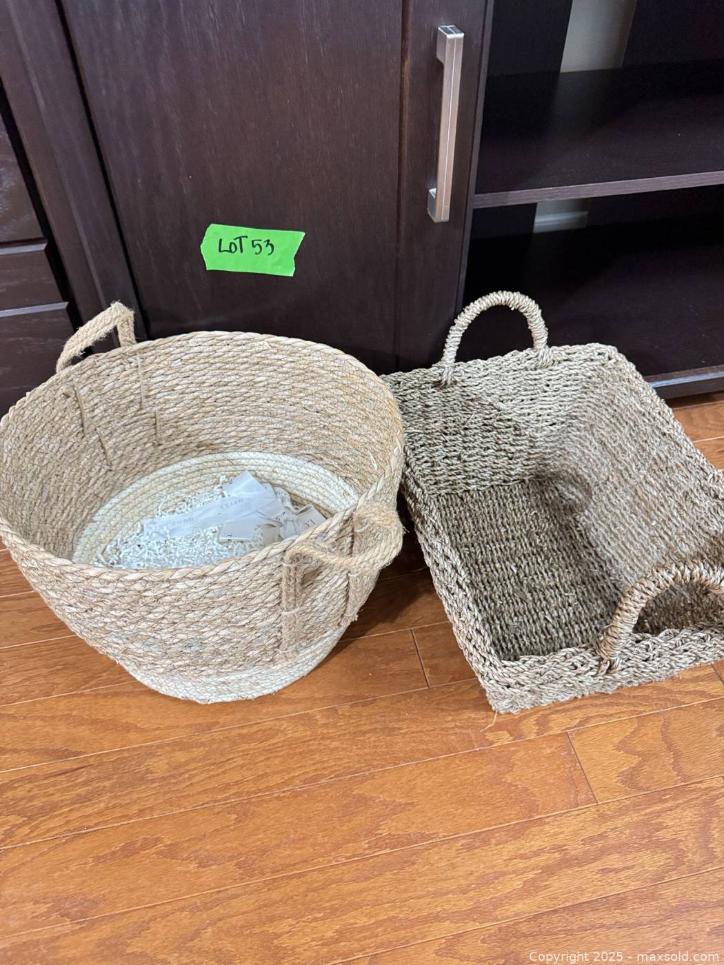Two natural woven storage baskets with handles | Maxsold