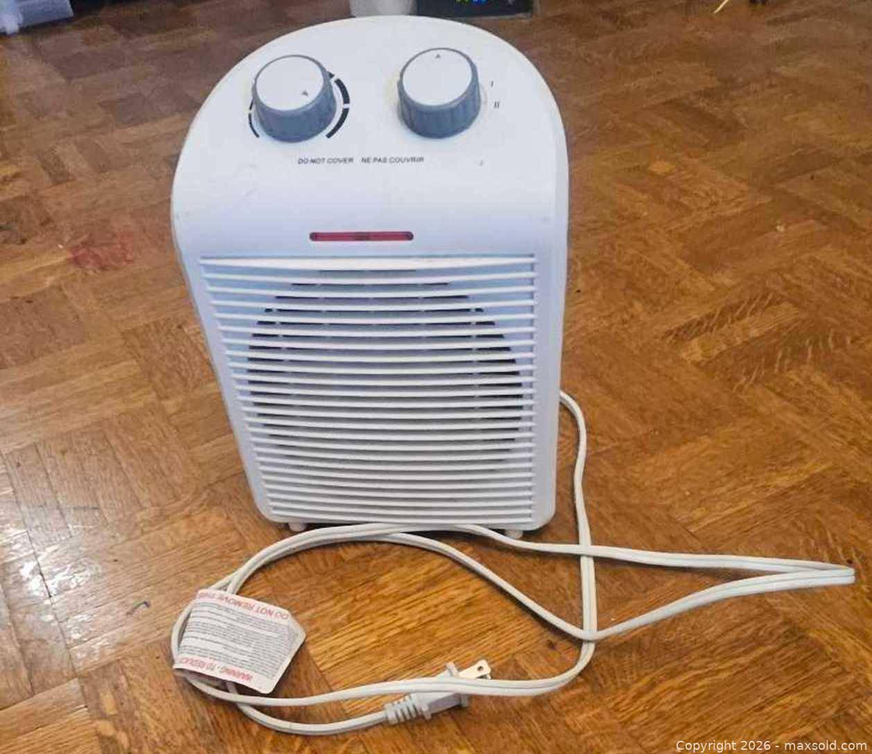 White portable fan-forced electric space heater | Maxsold