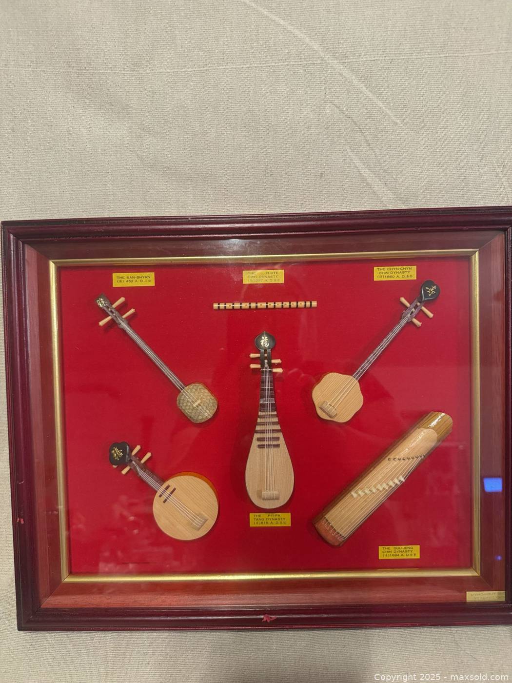 Framed wood shadowbox with 5 miniature Chinese musical instruments ...