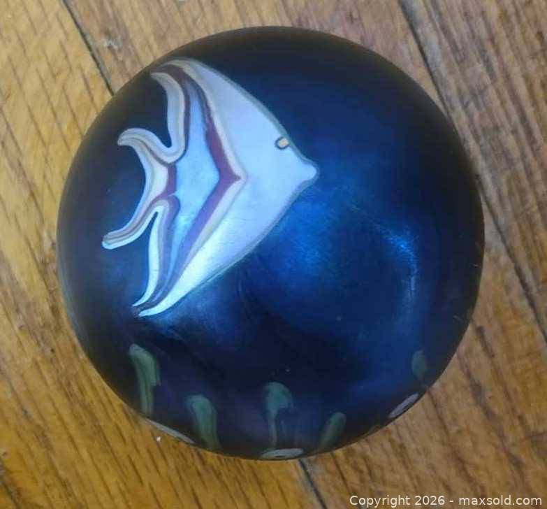 1977 signed iridescent glass paperweight | Maxsold