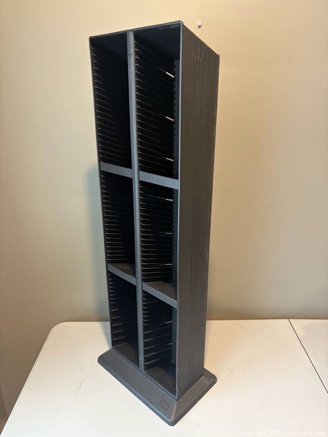 Black plastic CD tower | Maxsold