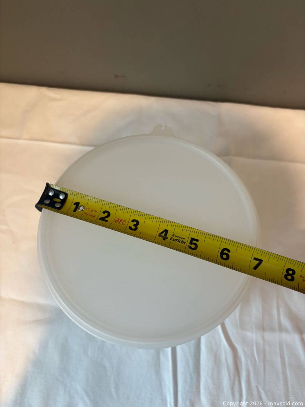 Frosted Tupperware plastic cylinder container with lid | Maxsold