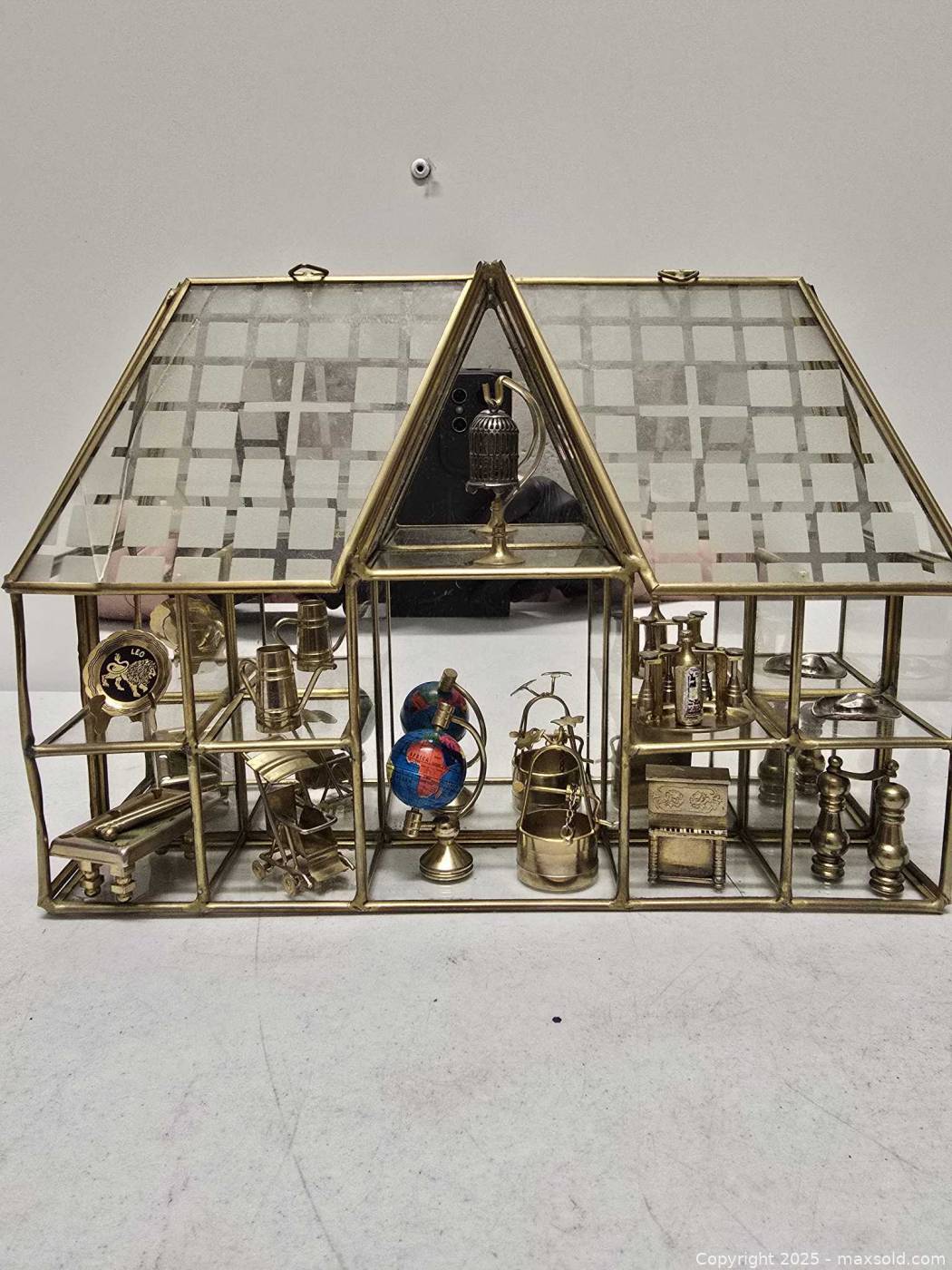 Brass and glass miniature display house with assorted metal miniatures ...