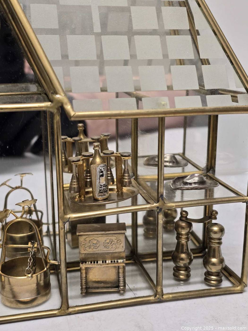 Brass and glass miniature display house with assorted metal miniatures ...