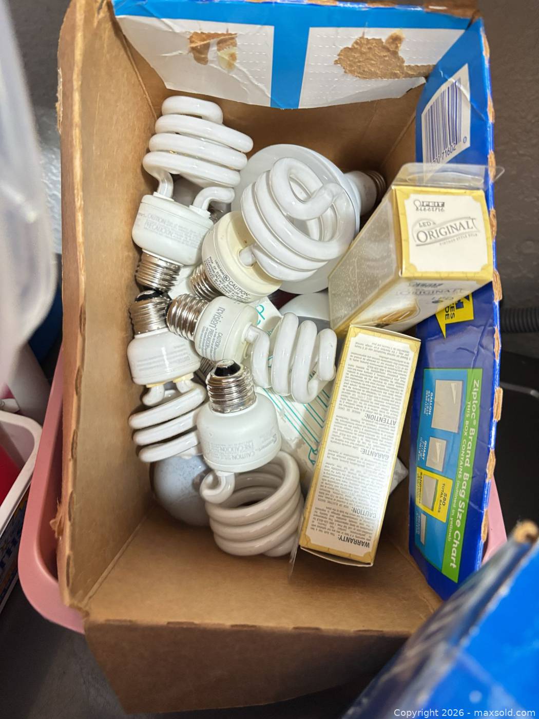 Assorted Cleaning Supplies & CFL Bulbs | Maxsold