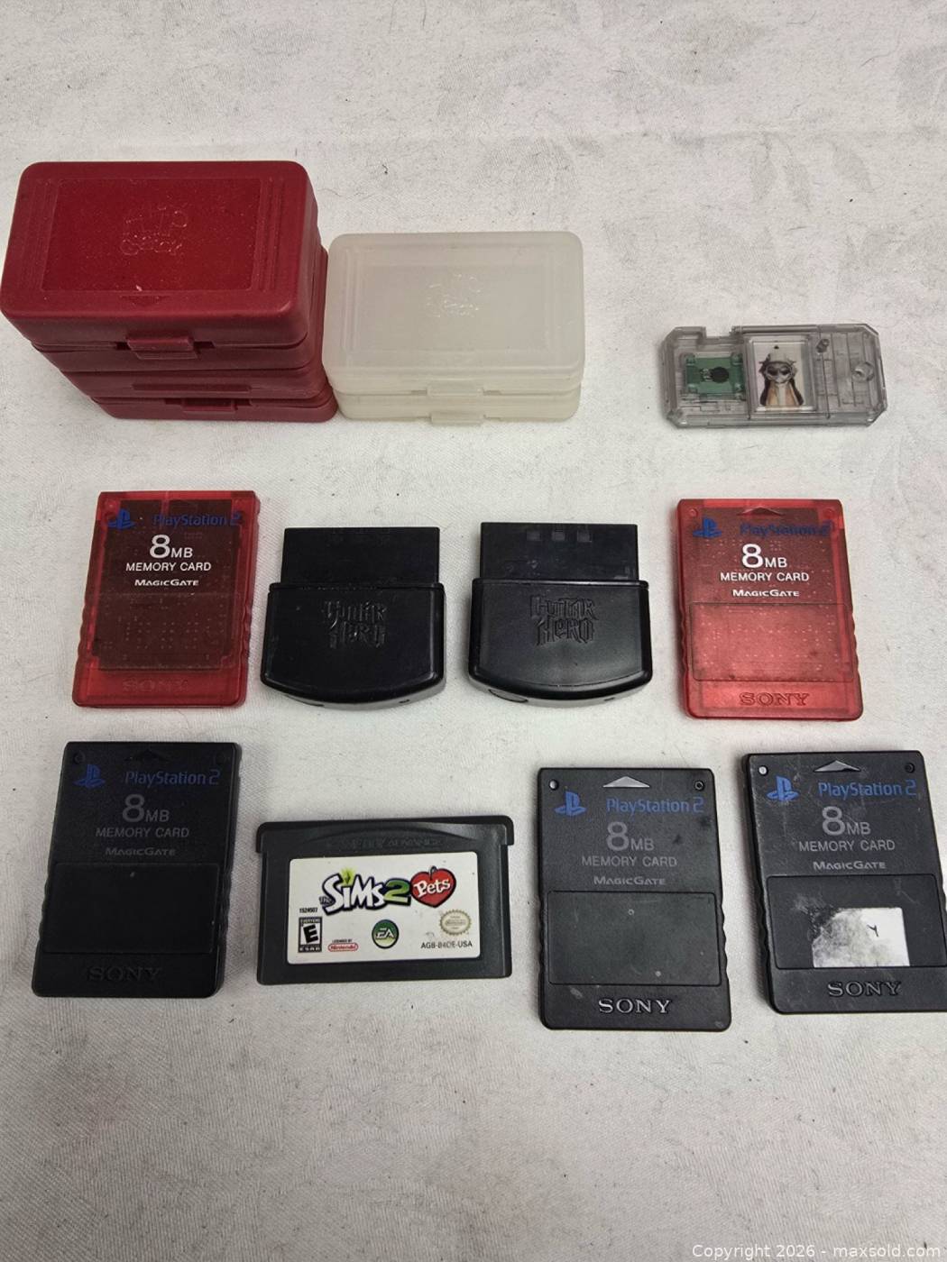 Sony PS2 8 MB memory cards, cases, Sims 2 GBA, guitar receiver | Maxsold