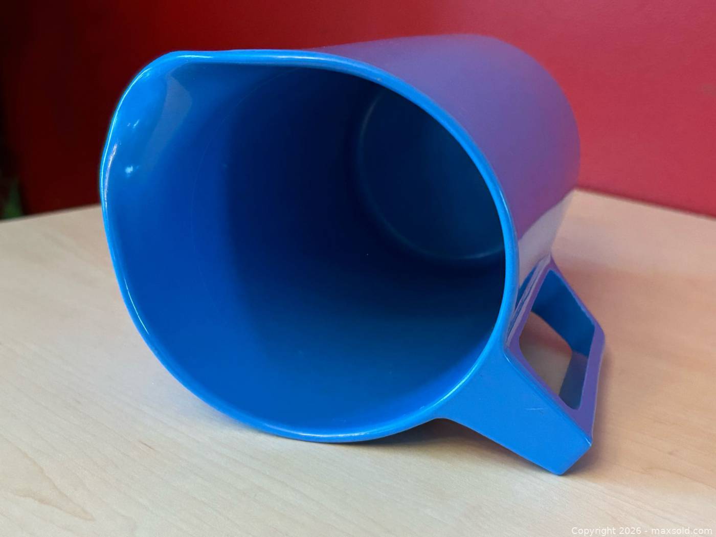 Melmac blue plastic pitcher, 1972 | Maxsold