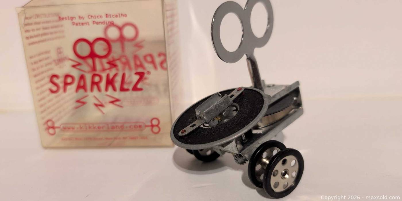 Kikkerland Sparklz wind-up novelty toy with original box | Maxsold