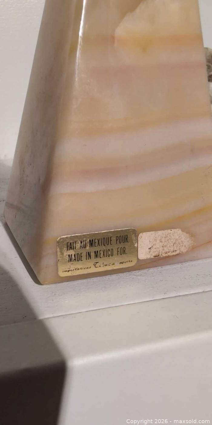 Stone obelisk, stone paperweight and raccoon figurine | Maxsold