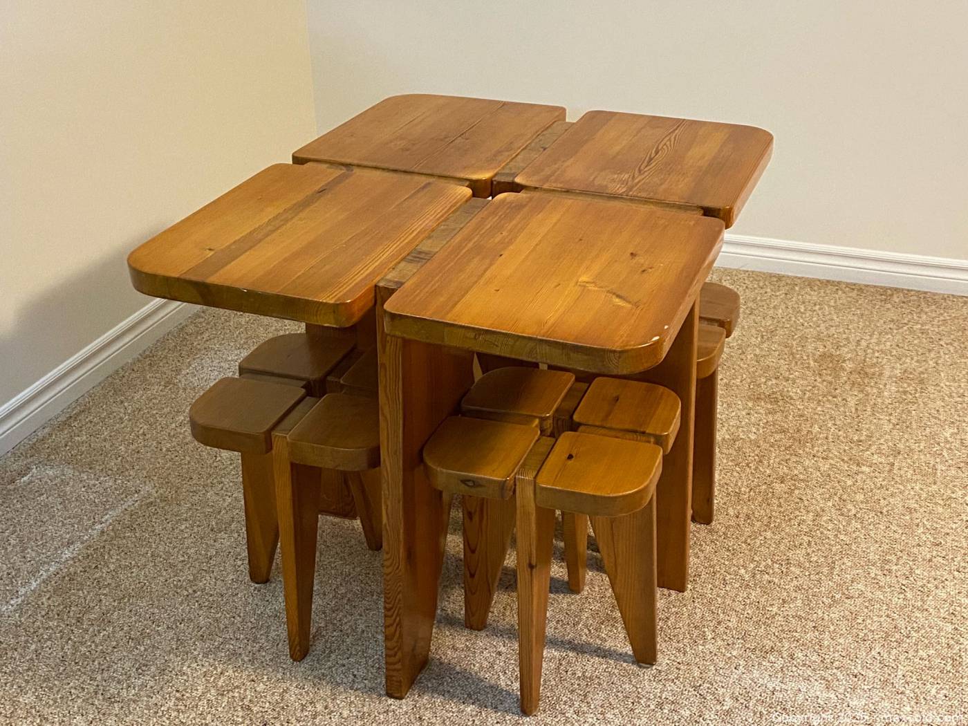Solid wood dining table with four nesting stools | Maxsold