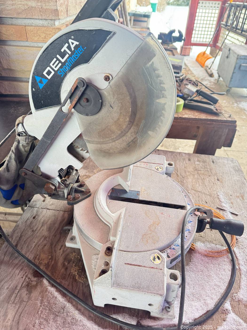 Delta ShopMaster compound miter saw on stand | Maxsold