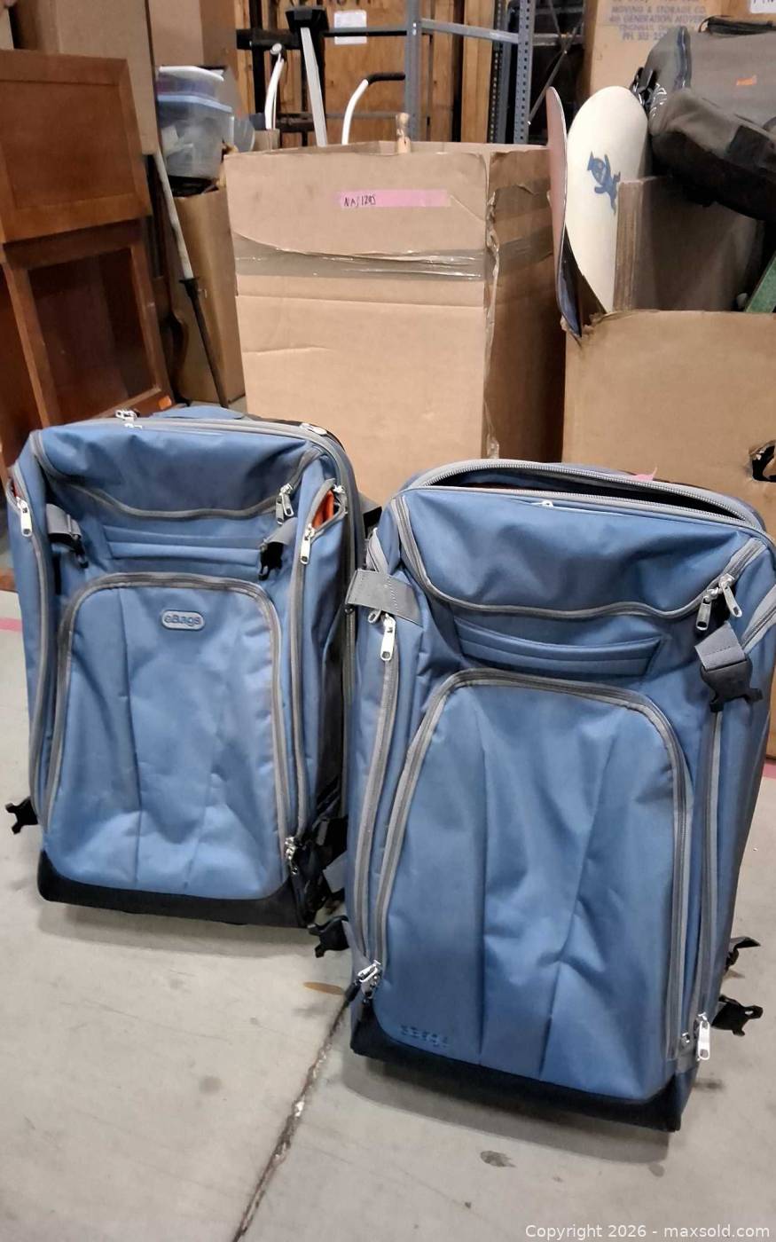 Pair of eBags blue rolling suitcases | Maxsold